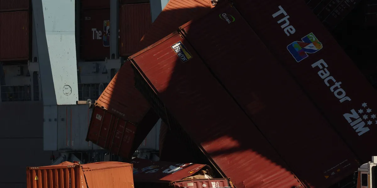 Containers fall from Zim ship onto emission-capture barge and into ...