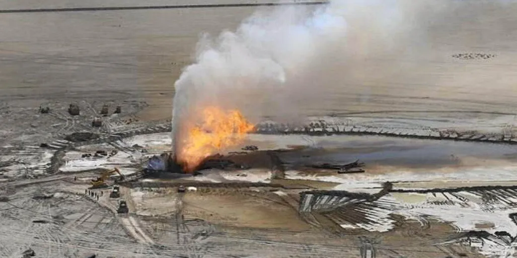 Fire burns in oil well a month on from blowout with emergency services ...
